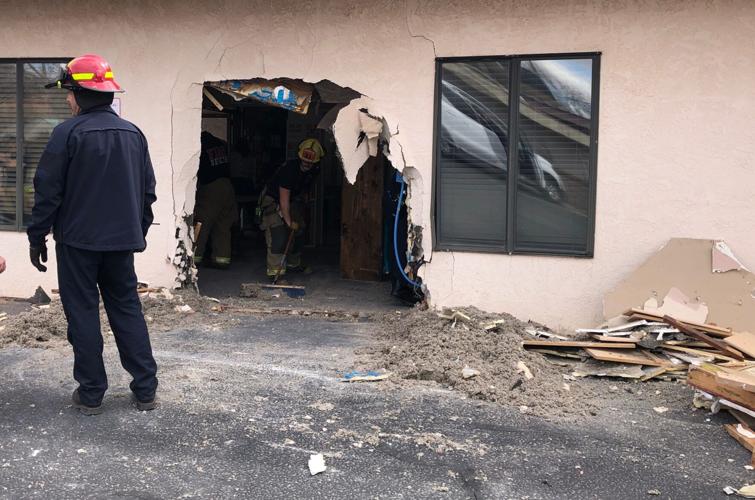 Merchandise, debris scatter in all directions when SUV crashes into ...
