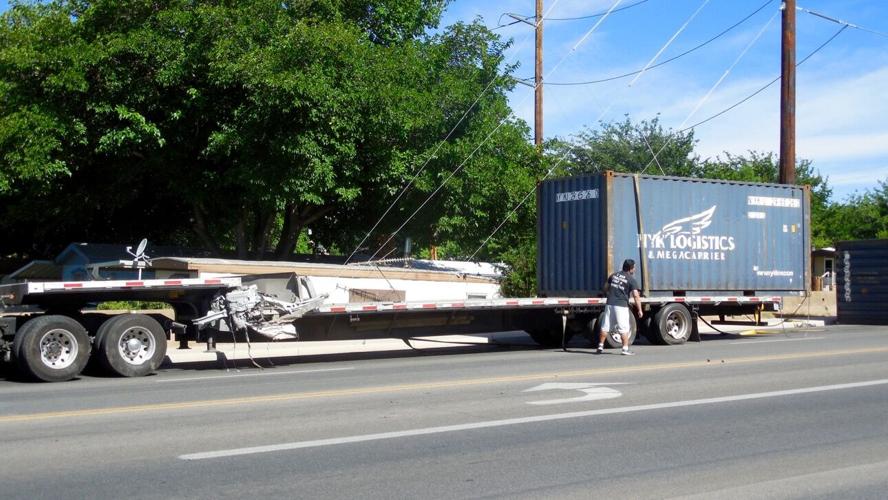 Collision with semi results in serious injuries, scattered storage ...