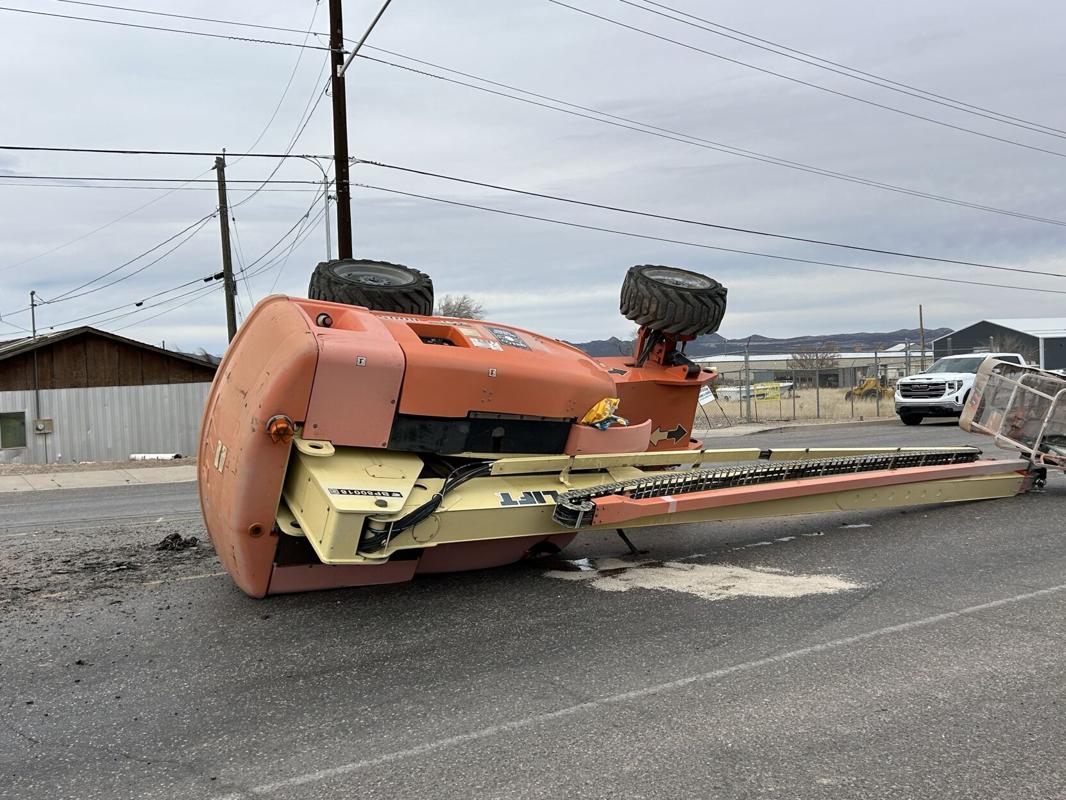 Driver loses load as boom lift tips off trailer onto Cedar City's ...