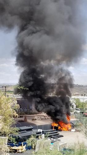 Black smoke billows from manufacturing area as industrial material ...
