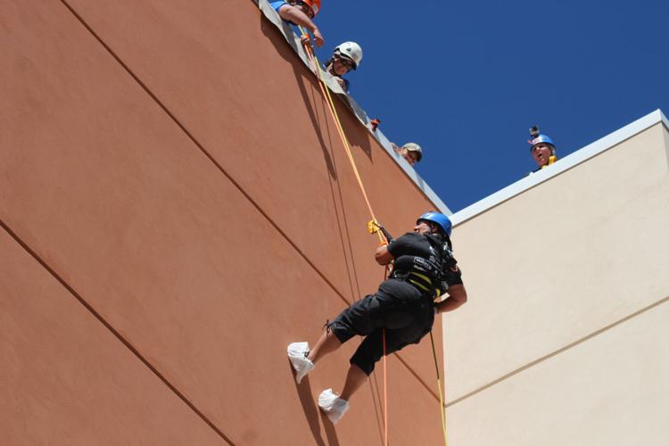 Radio DJs join people rappelling down 5-story hotel in St. George to ...
