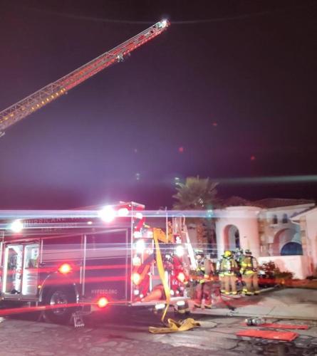 Fire erupts in Hurricane home’s attic, forcing 14 people to flee ...