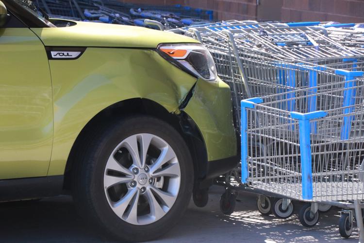 Driver has medical episode, crashes into parked car, shopping carts at ...