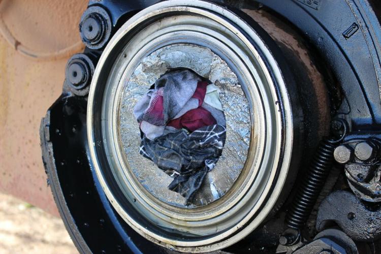 Huge construction scraper loses wheel, spills hydraulic fluid onto ...