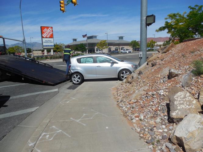 Left-turn collision sends car careening into light pole | Local News ...