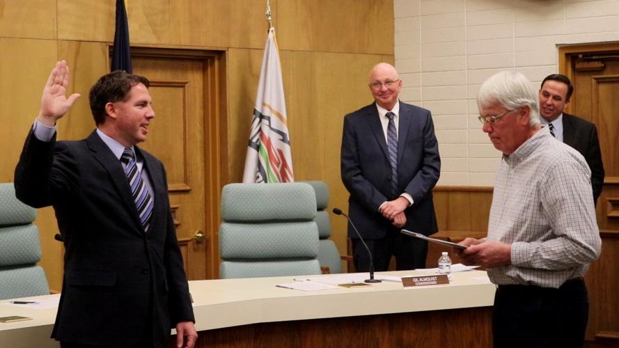 Eric Clarke sworn in as acting County Attorney; commission bids ...