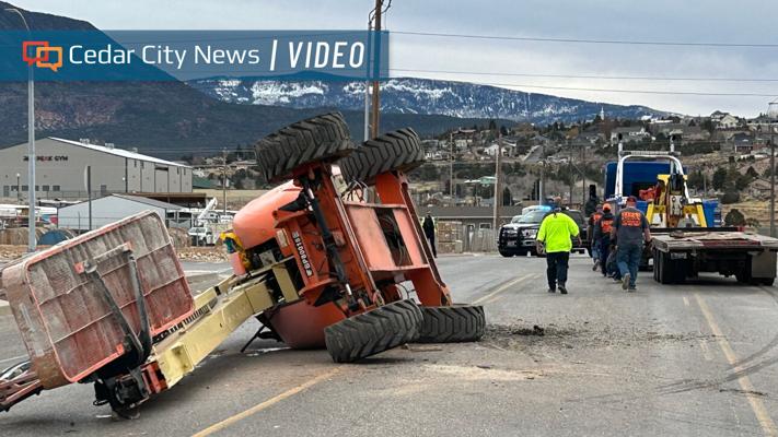 Driver loses load as boom lift tips off trailer onto Cedar City's ...