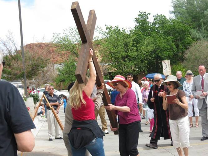 Stations of the Cross attendees walk to commemorate Christ’s journey ...