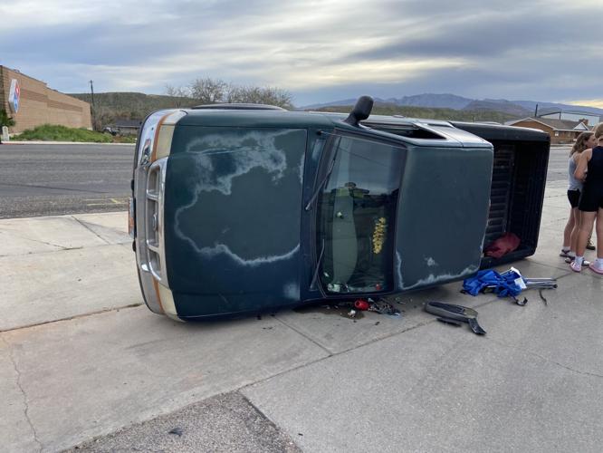 After driver runs red light, collision causes pickup to flip into ...