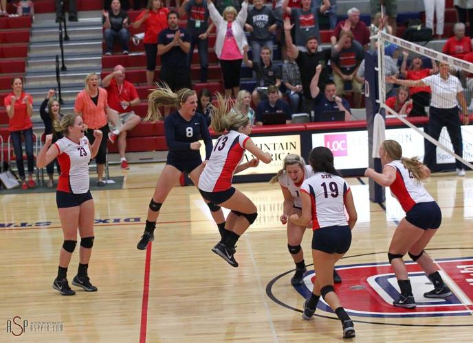 Red Storm spikers win battle of conference unbeatens to take over first ...
