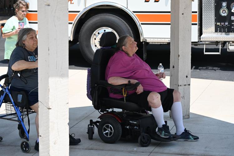 Roxie Weber residents work to replace flags at their housing complex ...