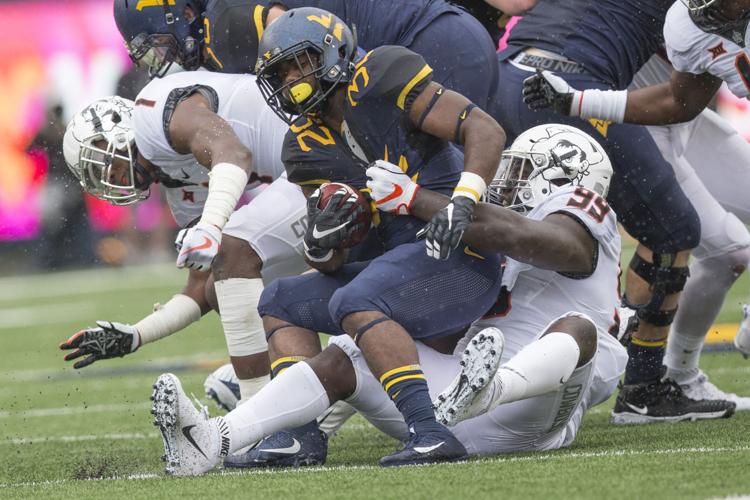 Rudolph shines in rain, Cowboys defeat WVU | Sports | stwnewspress.com