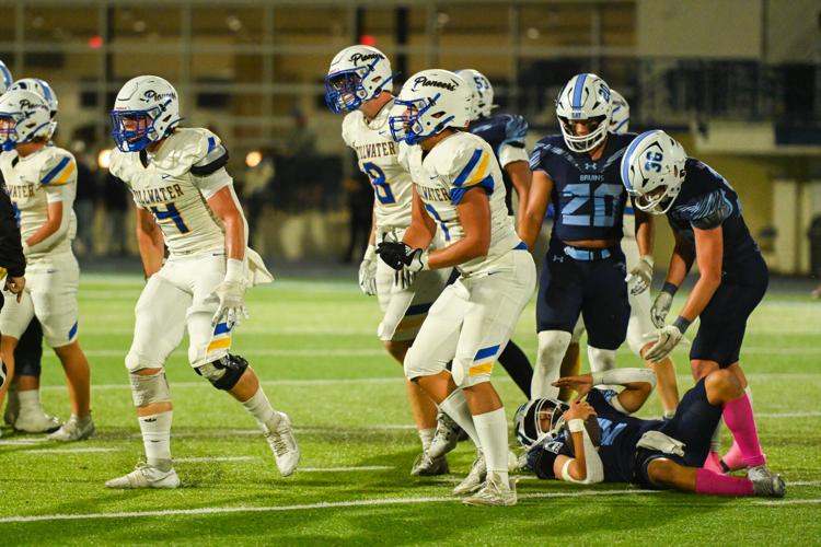 PHOTO GALLERY: Stillwater football fends off district foe Bartlesville ...