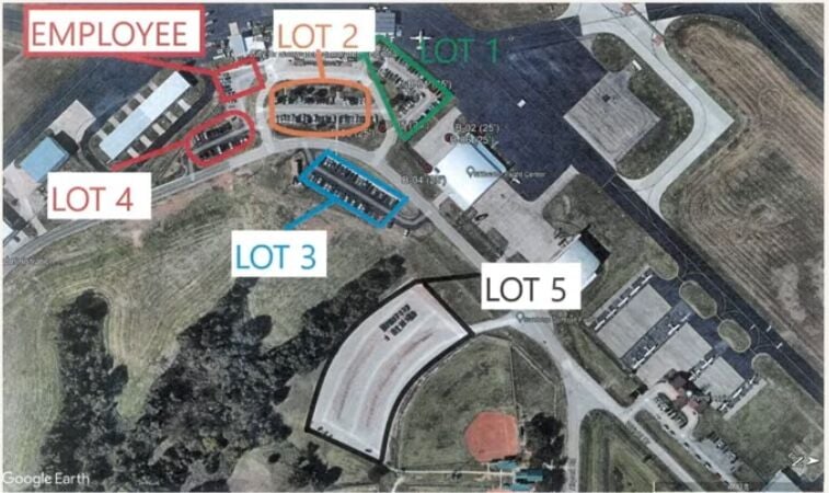City discusses charging for parking as new parking lot development ...