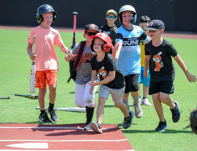 PHOTO GALLERY: Cowboy baseball campers enjoy playing on the diamond and ...