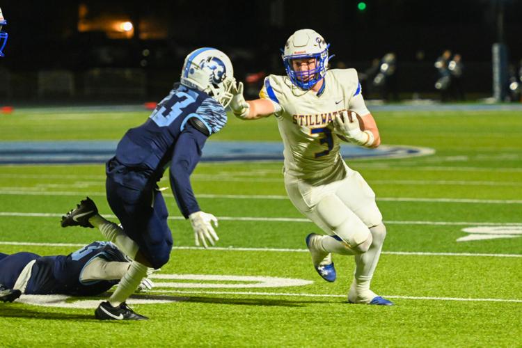PHOTO GALLERY: Stillwater football fends off district foe Bartlesville ...