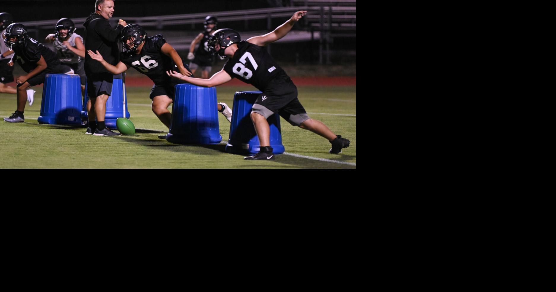 Midnight madness: Perkins-Tryon holds first football practice in the ...