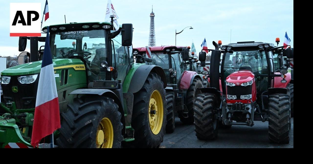 Hundreds of French farmers drive tractors through the capital to ...