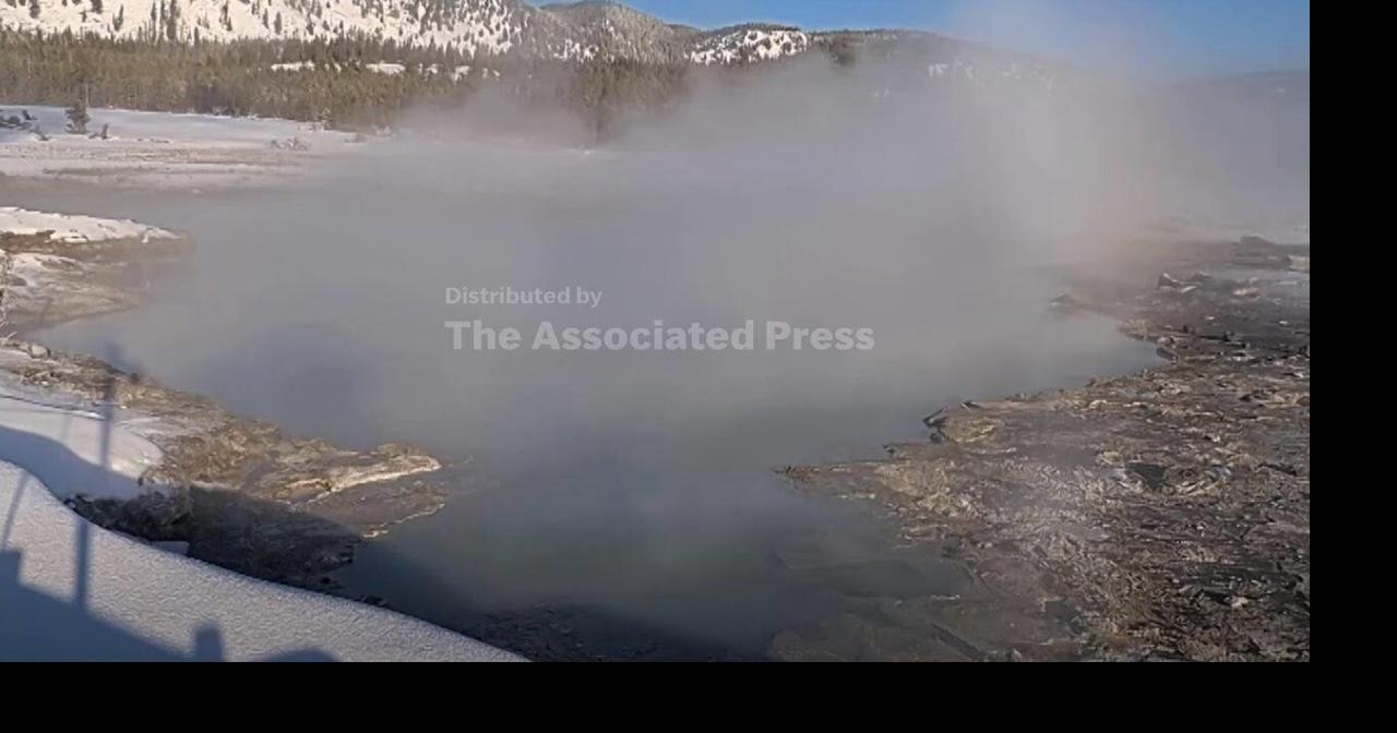 Muddy eruption at Black Diamond Pool in Yellowstone National Park ...