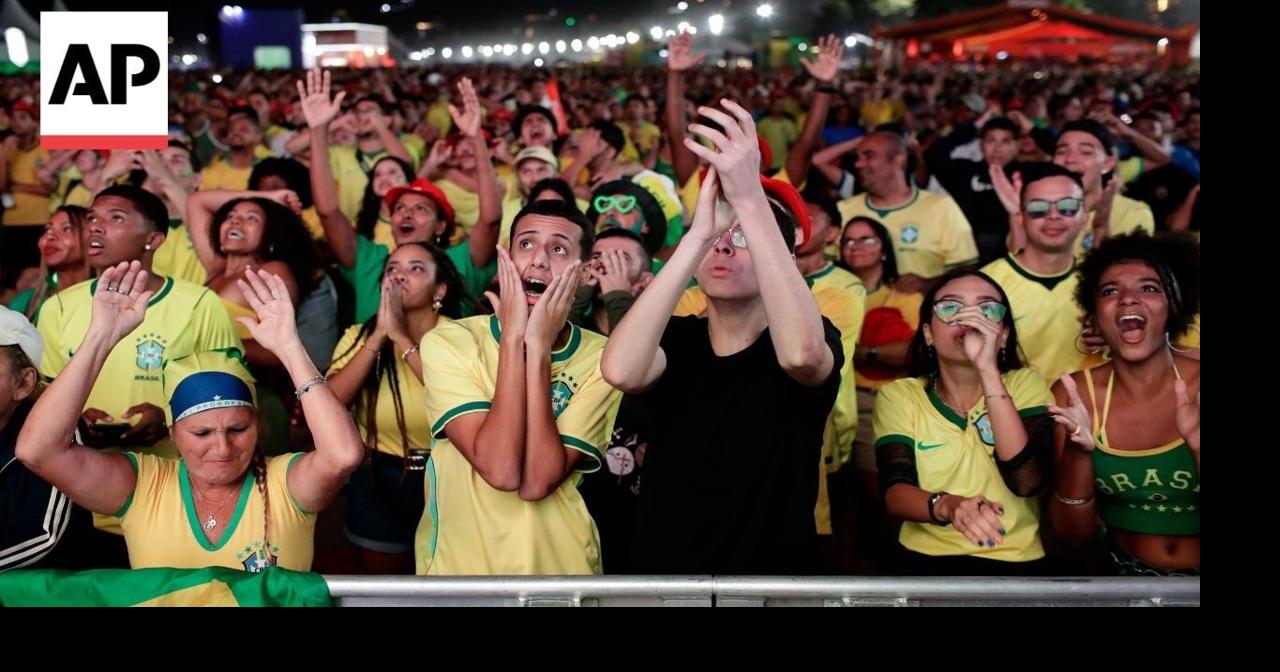 Brazil fans watch FIFA World Cup opener against Morocco on Copacabana ...