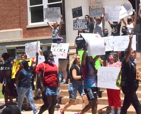 Peace rally calls for systemic change and community action for a better ...