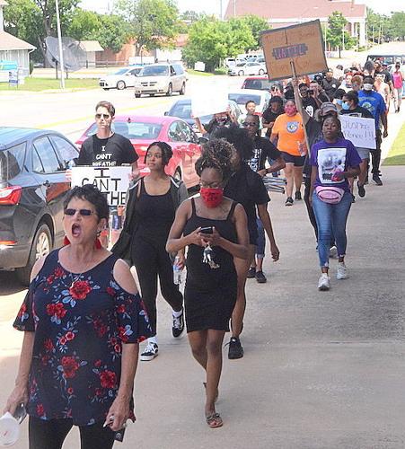 Peace rally calls for systemic change and community action for a better ...