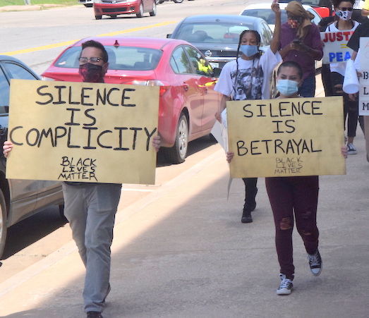 Peace rally calls for systemic change and community action for a better ...