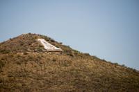 Hillside letters, symbols of town and school pride, are stamped on the ...