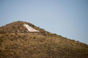 Hillside letters, symbols of town and school pride, are stamped on the ...