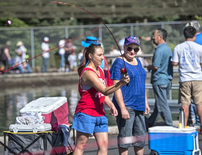 Special needs kids hook thousands of trout at Merwin Fish Hatchery