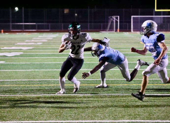 Woodland defense takes over as Beavers football routes Monarchs