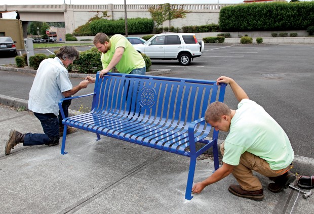 Service groups behind 'Kelso blue' benches downtown