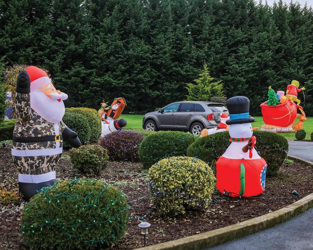 Woodland couple to give away most of 80 inflatable Christmas displays