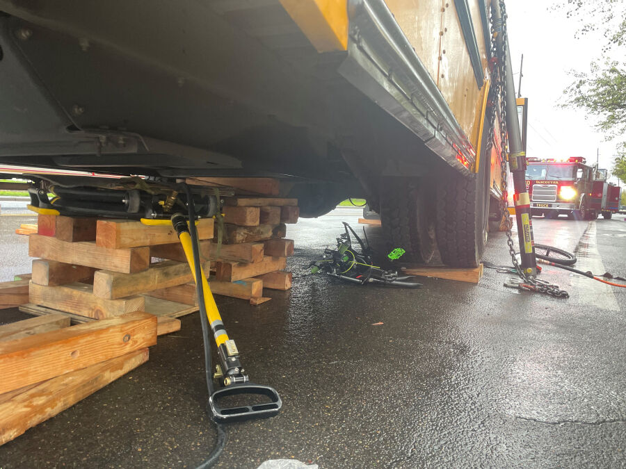 9-year-old on bicycle pulled under rear axle of school bus in Vancouver