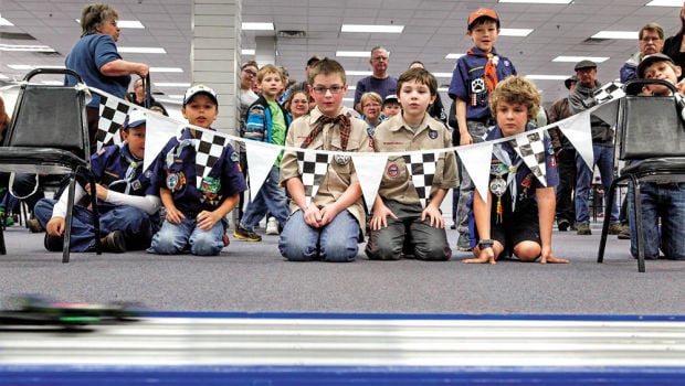 Cub Scouts race mini cars at Pinewood Derby