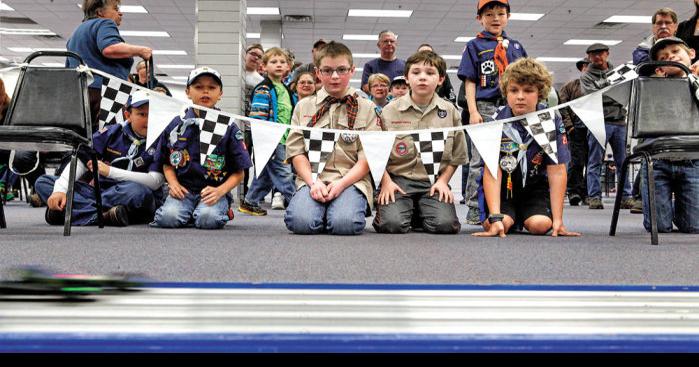 Cub Scouts race mini cars at Pinewood Derby