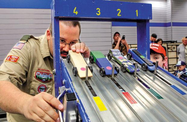 Cub Scouts race mini cars at Pinewood Derby