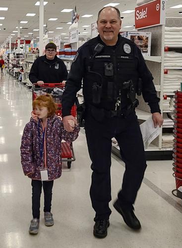 Kids recieve donated bikes, food at Kelso Shop with Cop