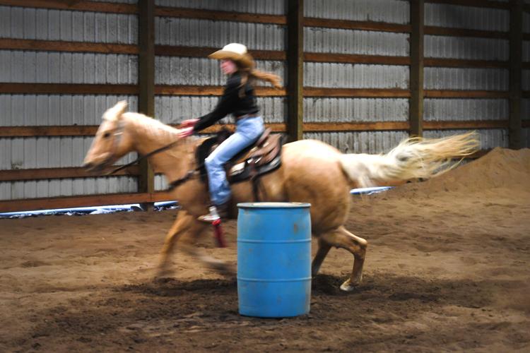 Longview teen barrel racer places first in world finals