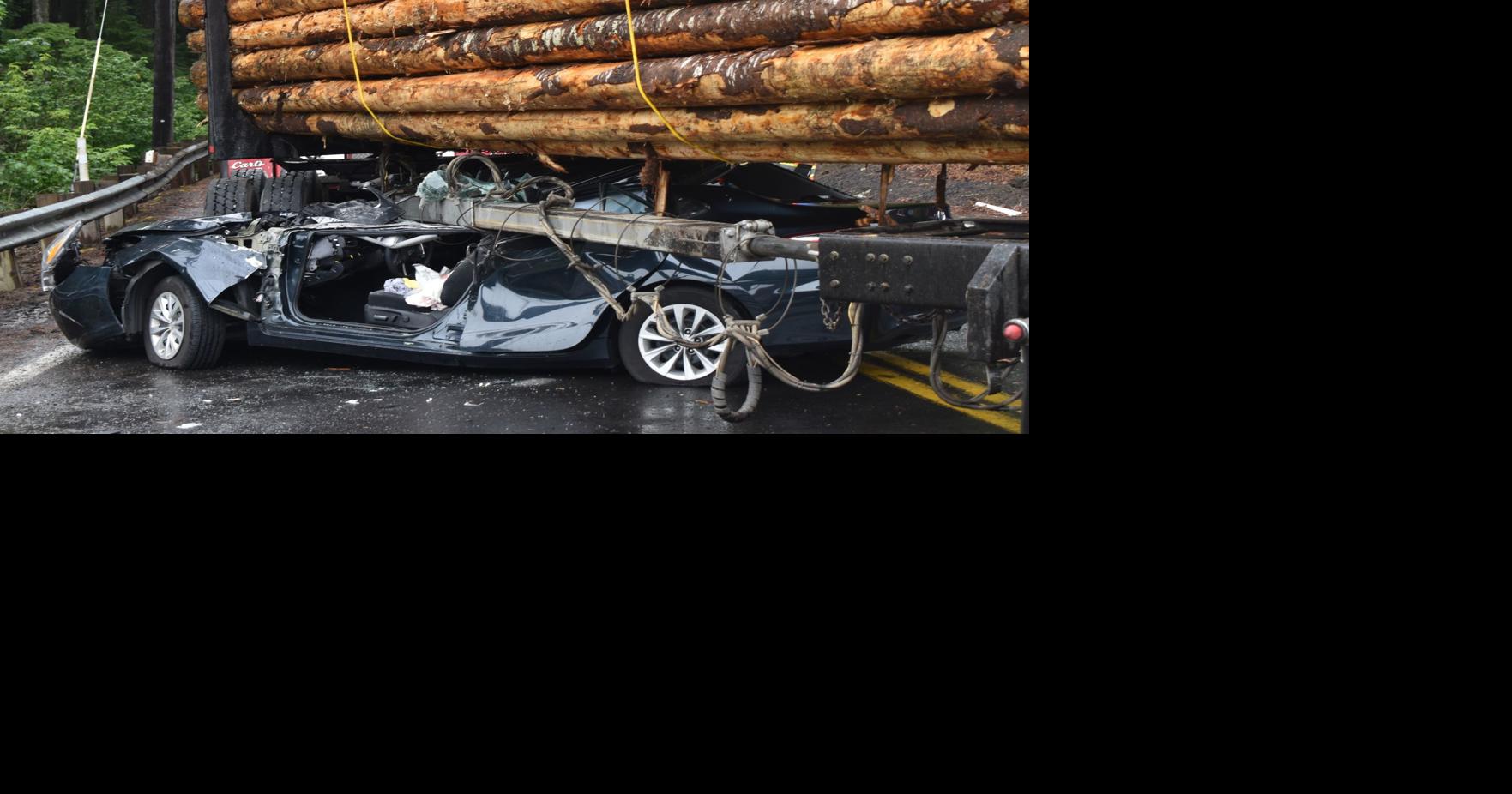 Driver trapped for 90 minutes under log truck suffers only broken jaw