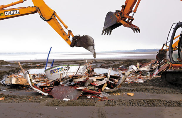 Crew dismantles grounded crab boat near Long Beach