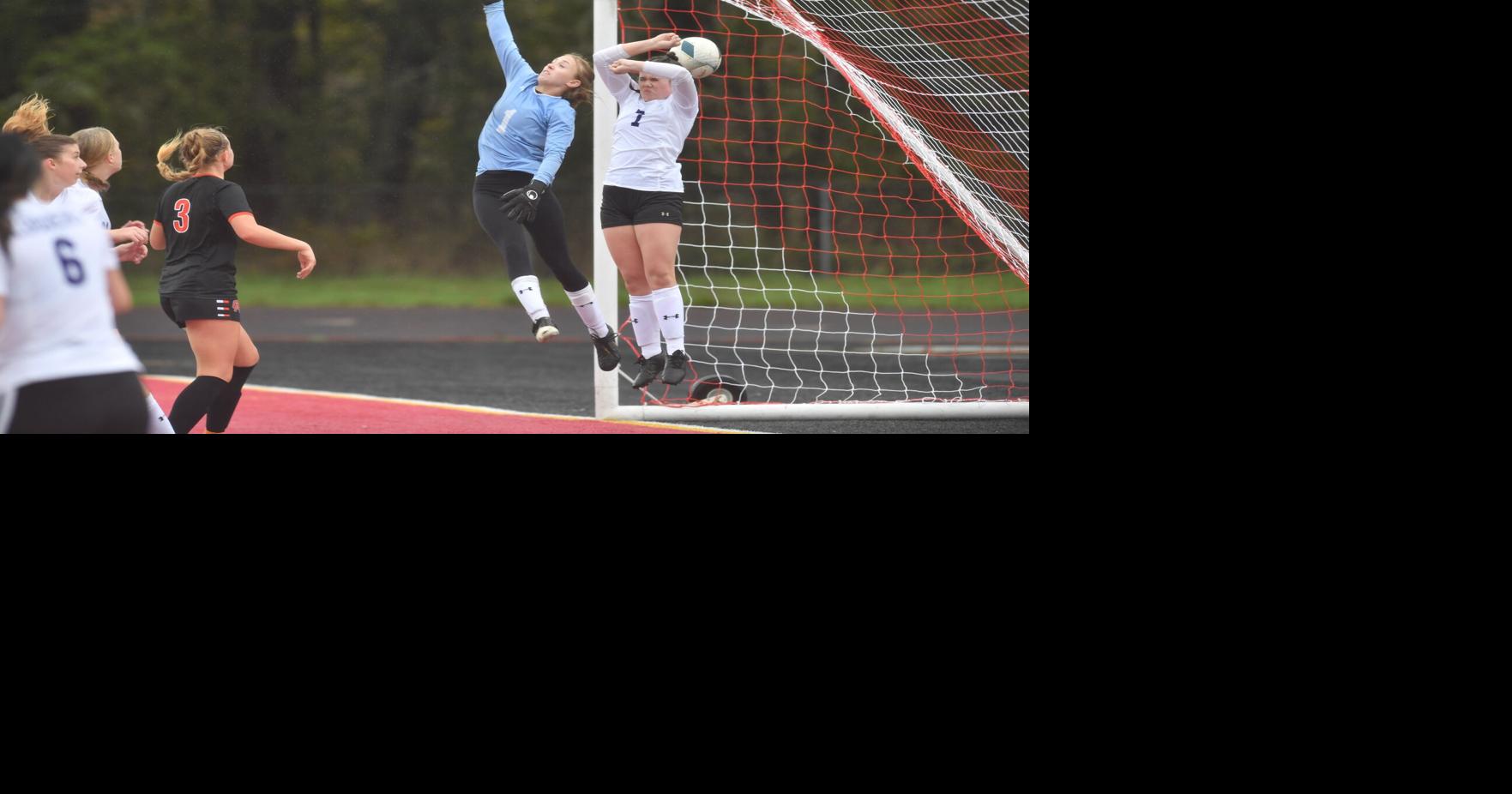 Kalama girls soccer leaping goal.JPG