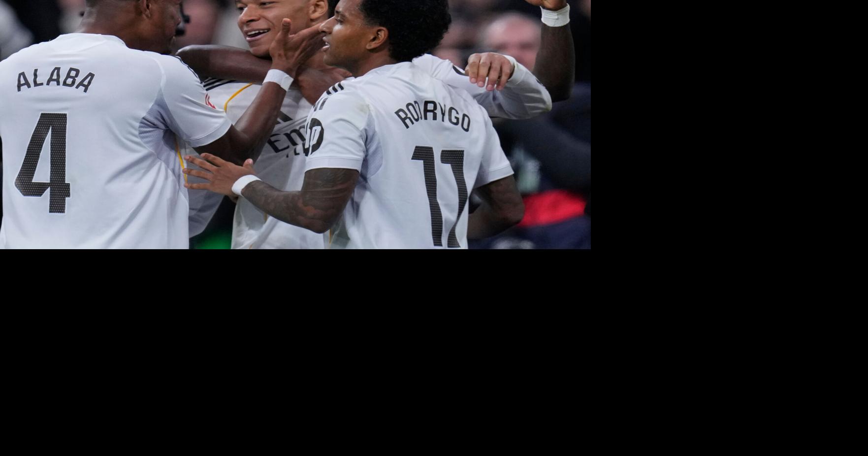 Mbappé's last-gasp penalty lifts Real Madrid to 2-1 win over Rayo ...