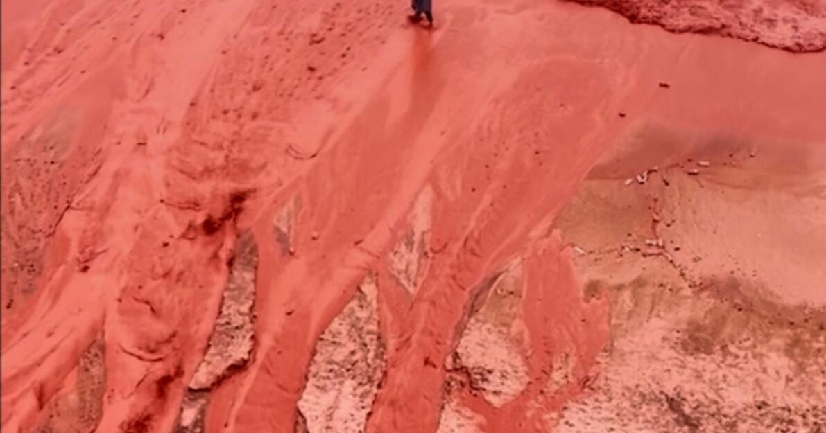 Rain creates a crimson spectacle on Iran's Hormuz Island for the first ...