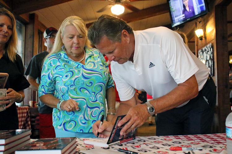 BELUE BOOK VALUE: Championship-winning Georgia QB signs books at ...