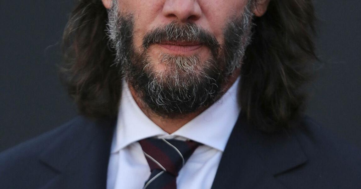 Woaah, that's no air guitar. Keanu Reeves grabs his bass for a rare ...