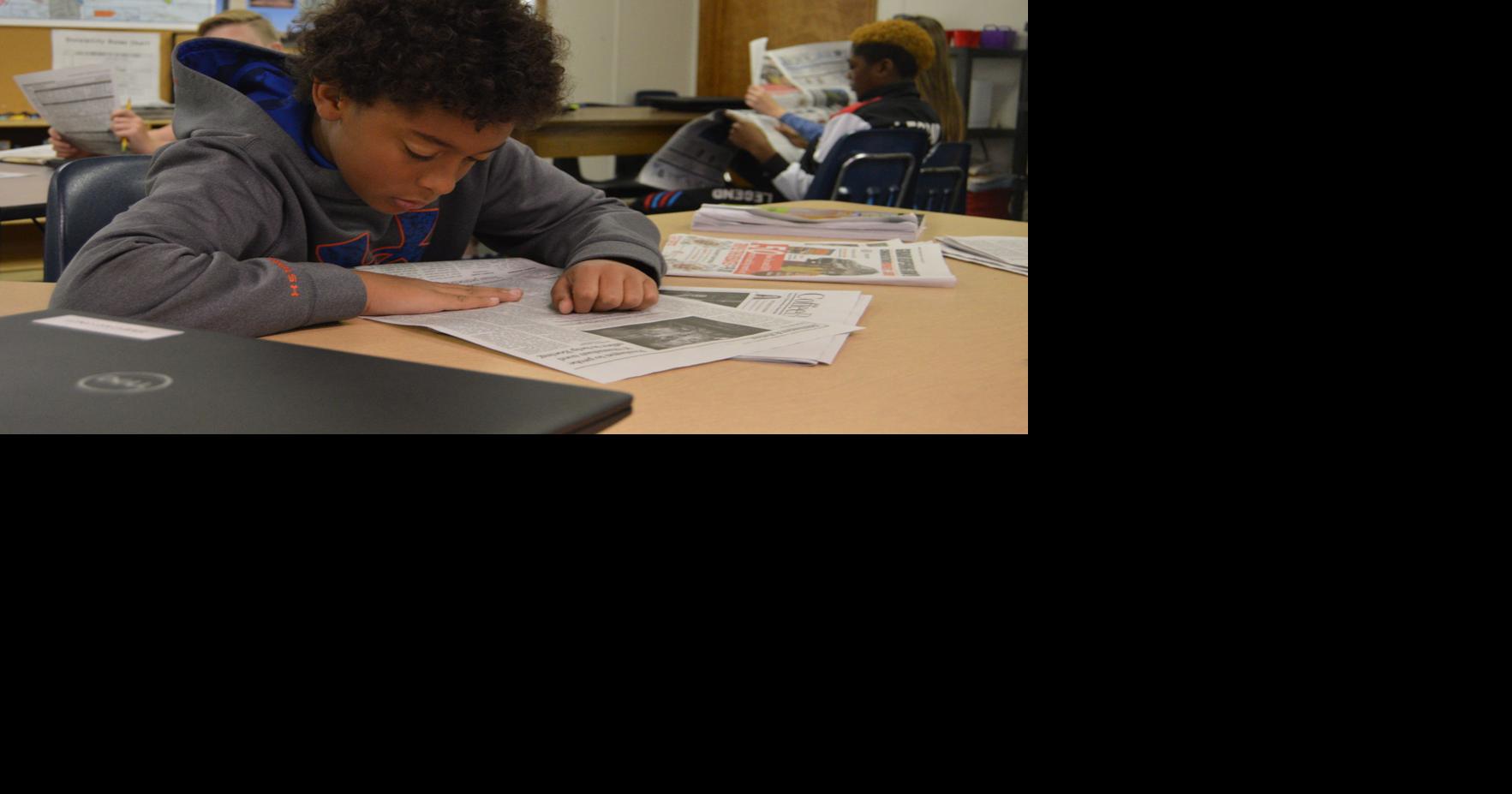 Teacher uses newspaper to connect students to current events ...
