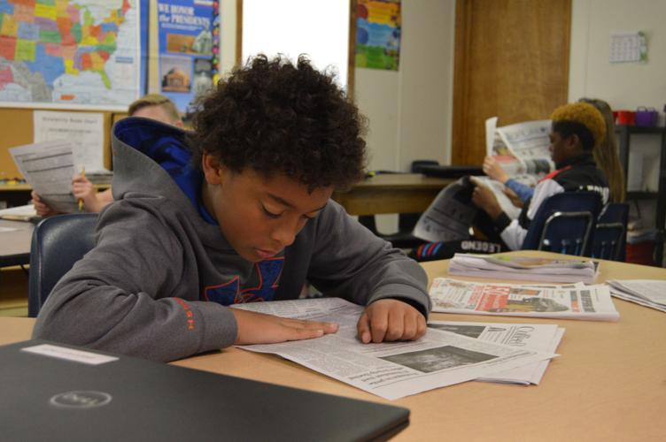 Teacher uses newspaper to connect students to current events ...
