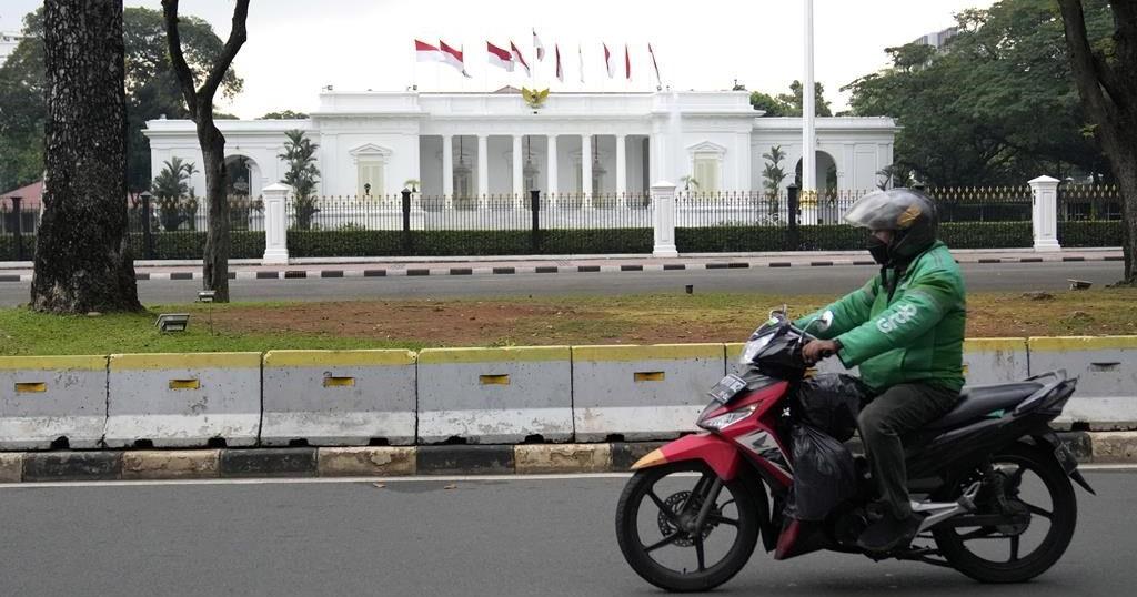 Indonesian woman arrested after pointing gun at palace guard | World ...