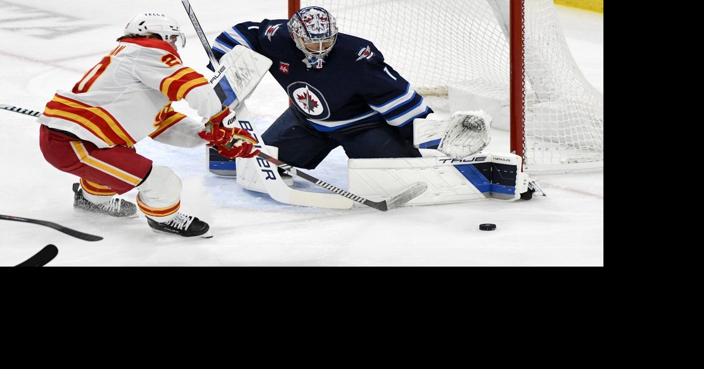 Jets' goaltender Comrie puts 'curse' to rest with 5-2 win over Flames ...